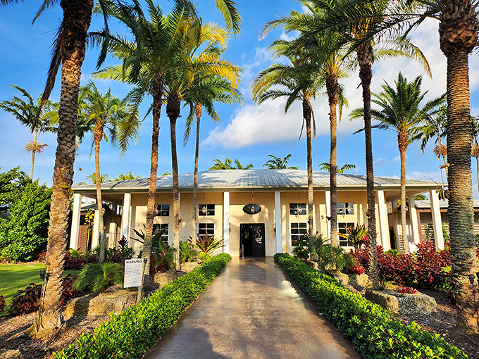 The grand coral rock building of Schnebly Redland's Winery rises from lush gardens, creating a Florida wine country experience.