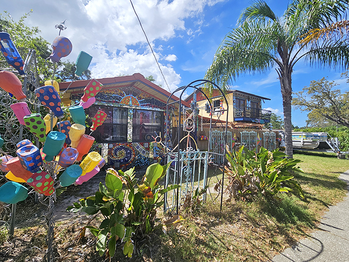 Colorful bottle trees and whimsical decorations transform this Safety Harbor home into a kaleidoscopic wonderland of recycled art.