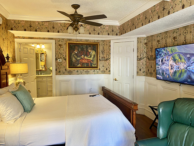 Classic Bedroom Interior: Sleep like royalty under watchful eyes &ndash; both from the elegant artwork and perhaps the gentleman ghost who appreciates fine decor.