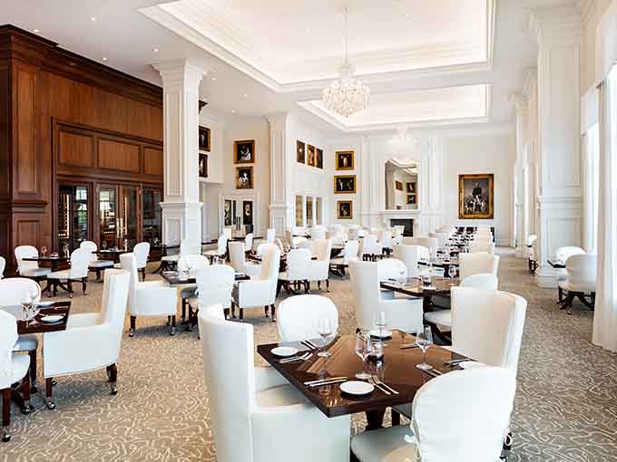 White chairs and dark tables create a dining room so pristine, you'll feel guilty about potentially spilling marinara sauce on anything.