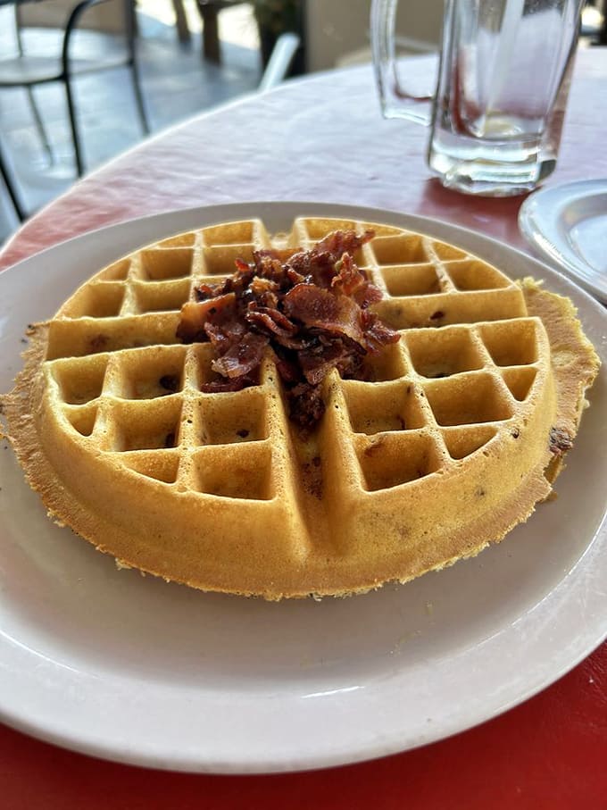 The bacon waffle is pure genius, combining sweet and savory in one crispy, fluffy, bacon-studded circle of breakfast perfection.