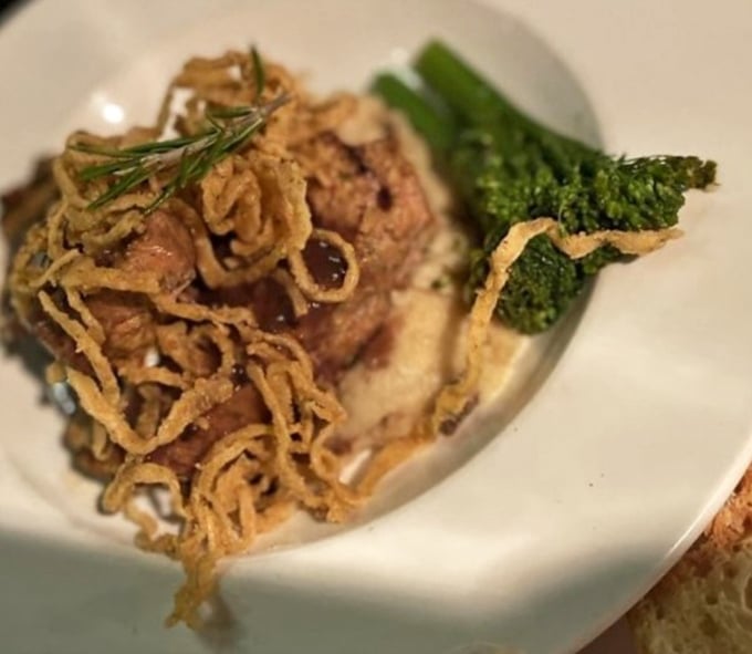 Comfort food gets the gourmet treatment with this meatloaf, where crispy onion strings crown the homestyle favorite like edible jewelry.