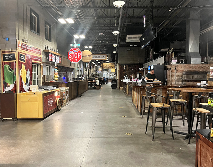 The market's main corridor buzzes with life as shoppers weave between stalls, following their noses to their next discovery.