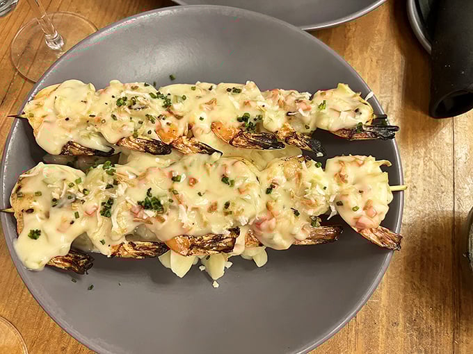 These shrimp skewers swim in a creamy sauce that would make even the most hardened culinary critic confess their love at first bite.