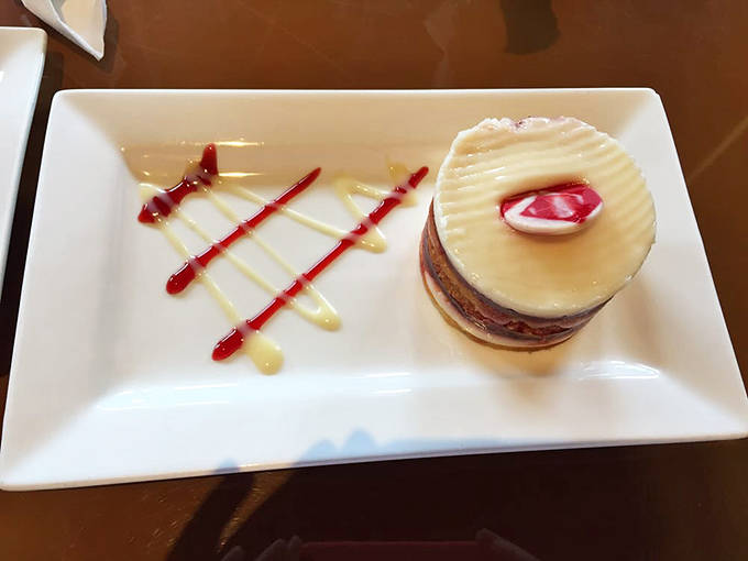 This isn't just dessert; it's architecture. A delicate tower of sweetness that makes you hesitate between photographing it or devouring it.