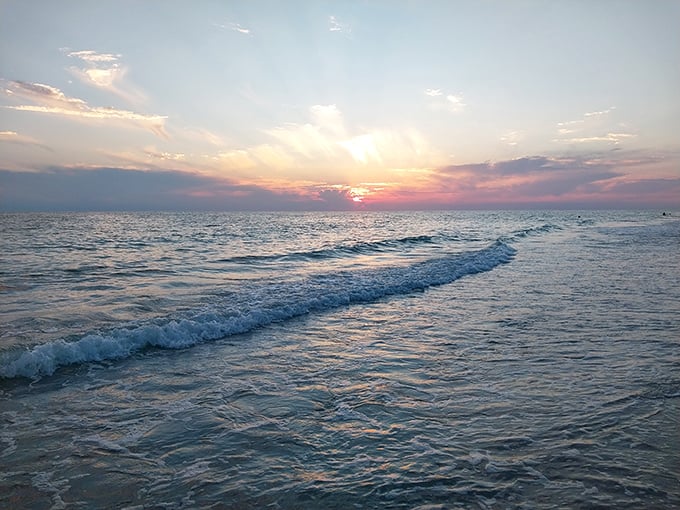 Magic hour: When the sky performs its nightly miracle, painting the Gulf waters with liquid gold and rose-colored dreams.