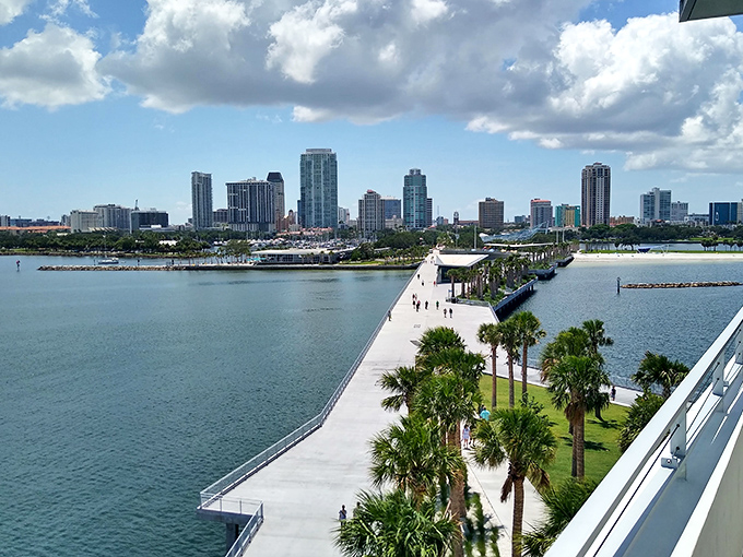 St. Petersburg's waterfront pier extends into the sparkling bay, with the city's modern skyline creating a perfect backdrop for affordable urban adventures.