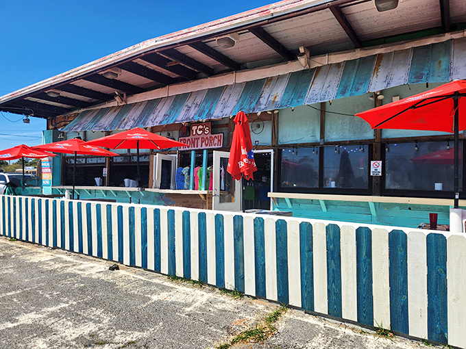 TC's Front Porch's weathered turquoise exterior embodies coastal casual dining. That colorful fence welcomes beach-goers and locals alike to kick back and enjoy!