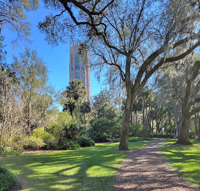The gardens surrounding the tower create a natural sanctuary where Spanish moss and oak trees frame perfectly peaceful walking paths.