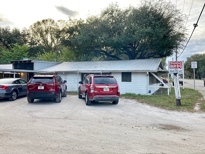 This unassuming white building houses barbecue secrets passed down through generations, drawing meat lovers from across Central Florida.