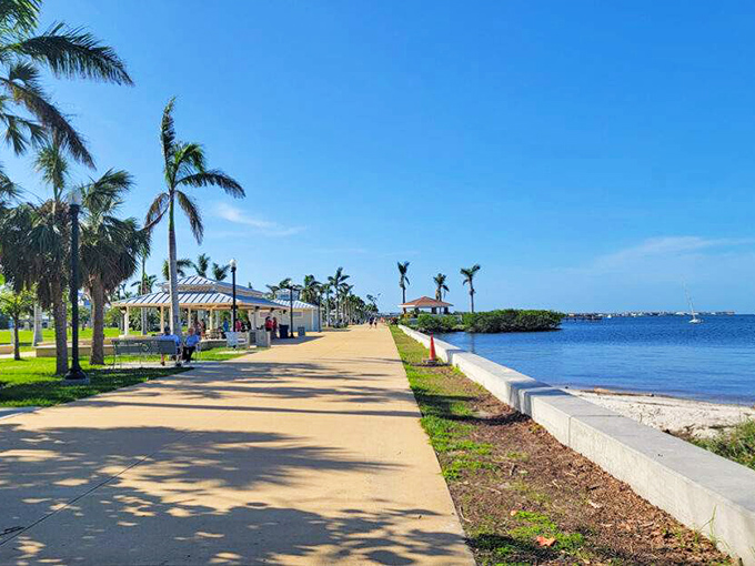The scenic harborwalk in Punta Gorda offers beautiful views across Charlotte Harbor, lined with palm trees and waterfront amenities.