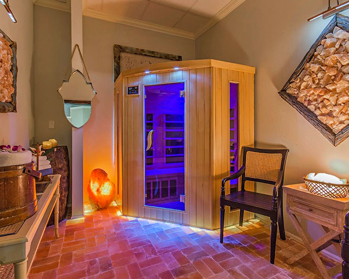 Wellness meets warmth in this modern infrared sauna, where purple light creates an atmosphere of calm and healing.