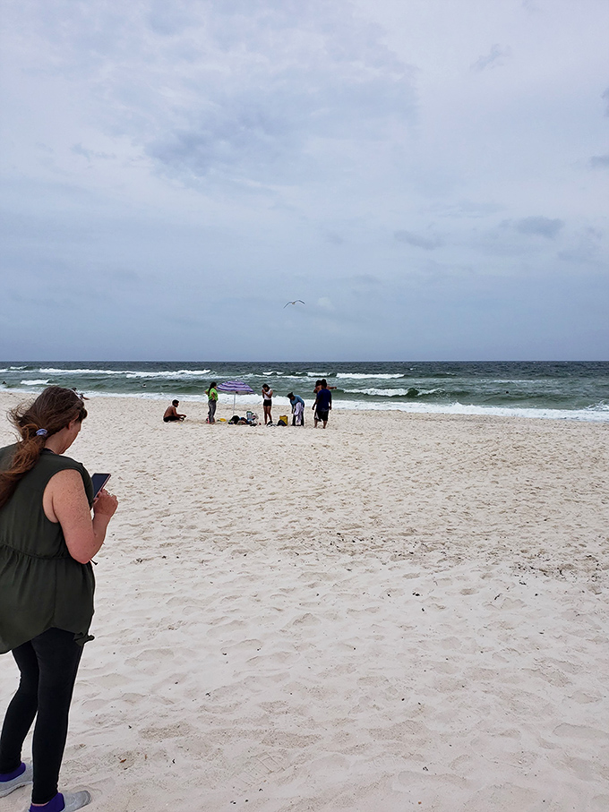 Beachgoers stake their claim on a quiet stretch of sand, creating memories that will outlast any souvenir.