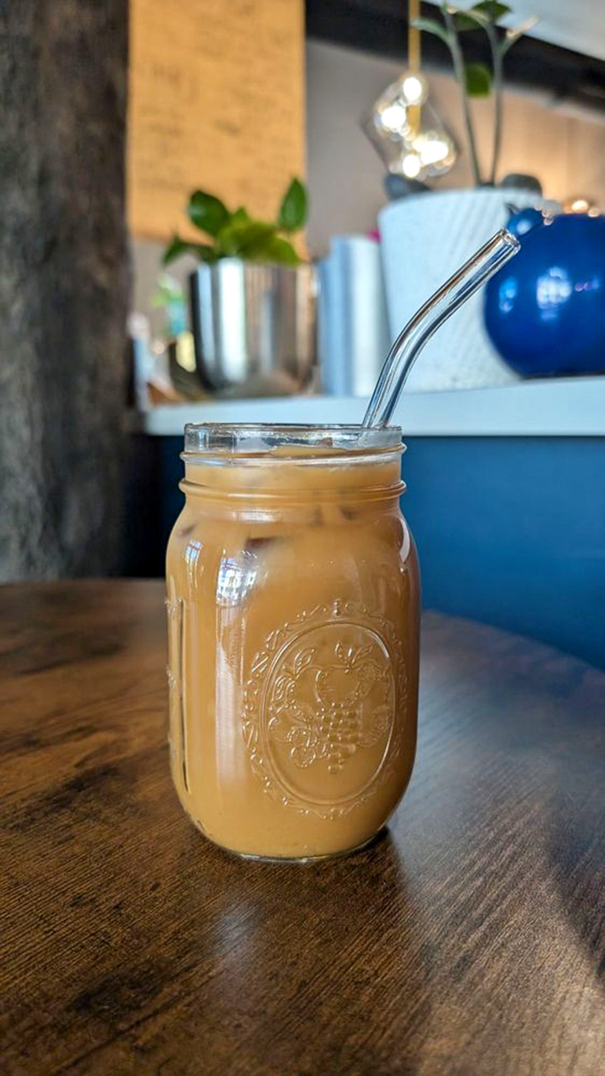 An iced Americano served in a mason jar that makes you simultaneously rustic and sophisticated &ndash; perfect for pretending you're working on a novel.