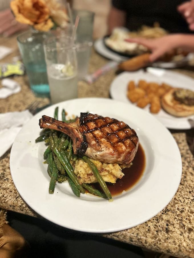 This bone-in pork chop has clearly been introduced to fire and flavor in equal measure&mdash;the grill marks tell stories.