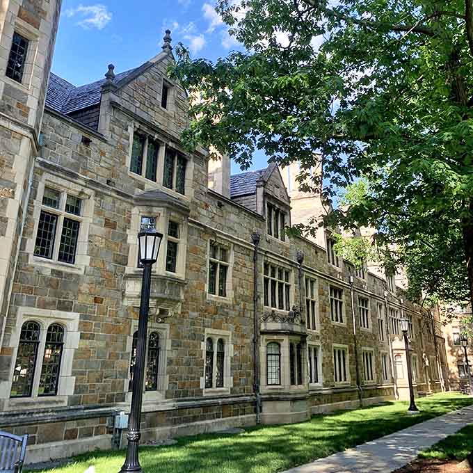 Weathered stone walls tell tales of academic traditions, while perfectly manicured grounds invite visitors to pause and admire the craftsmanship.