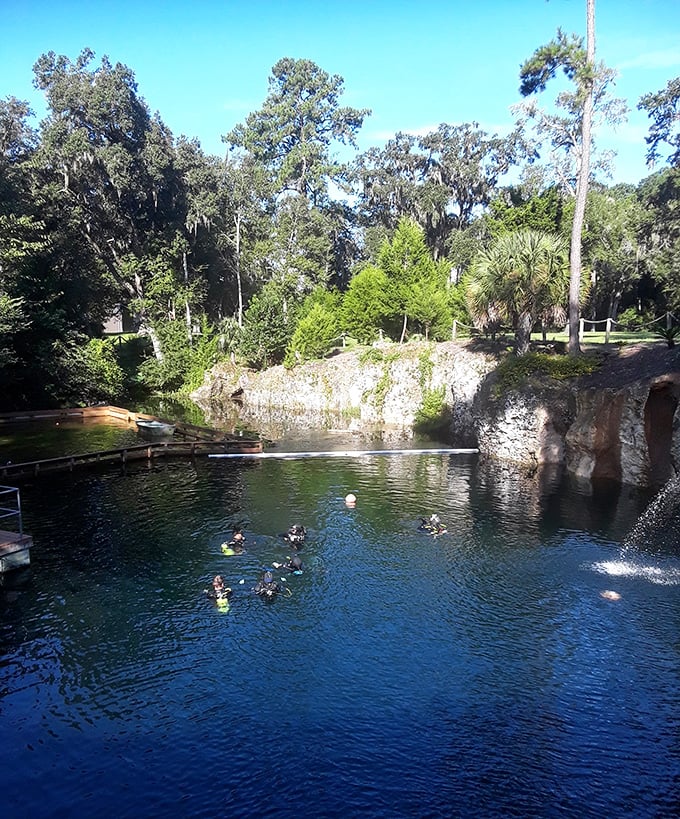 Summer sunshine filters through the crystal waters, creating ethereal light beams that transform the cavern into nature's own cathedral.