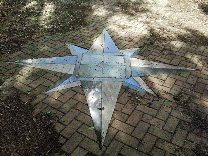 This compass rose embedded in the walkway suggests the builder knew exactly where he was going, even without those pesky blueprints everyone else relies on.