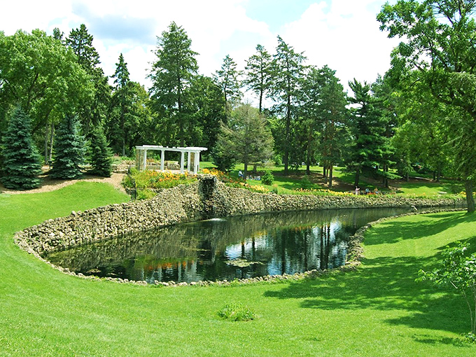 Como Park's serene pond reflects the Minnesota sky, creating a postcard-perfect scene that locals treasure year-round.
