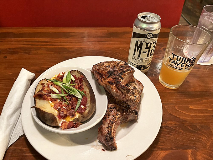Pork Chop: This isn't your grandmother's dry pork chop&mdash;it's juicy, perfectly seasoned, and served alongside a loaded baked potato that's practically a meal itself.