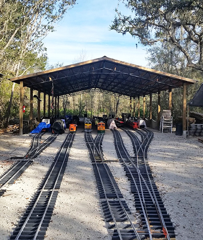 The train yard reveals the impressive infrastructure behind the magic&mdash;multiple tracks, switches, and a protective shelter that keeps these mechanical treasures safe between journeys.