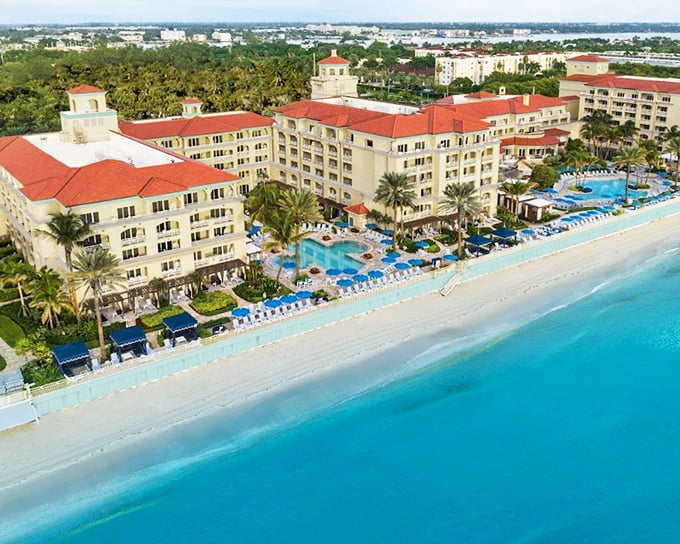 Oceanfront elegance at Eau Palm Beach, where the resort's distinctive architecture frames perfect views of Atlantic blue.