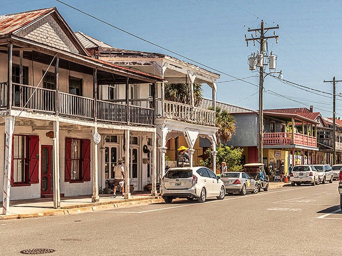 Pastel-colored historic buildings line Cedar Key's main street, preserving the Old Florida charm that's increasingly rare in the Sunshine State.