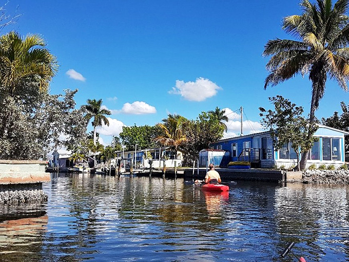 The waterfront canals of Matlacha showcase the island's blend of fishing village heritage and artistic spirit, with colorful homes lining the water.