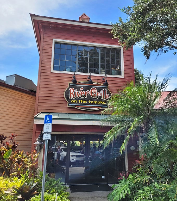 The distinctive sign welcomes diners to River Grille, where the peaceful Tomoka River and Florida foliage create a natural dining backdrop.