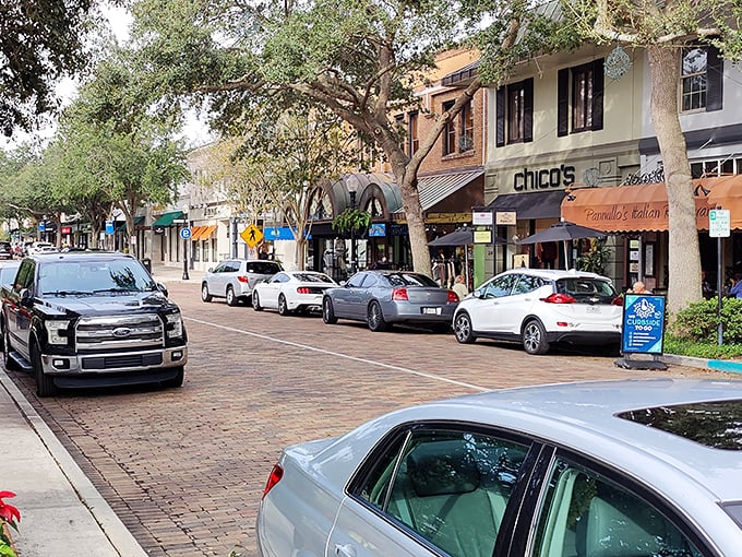 Winter Park's charming brick-lined streets invite window shopping and leisurely strolls, with boutiques and cafes creating a small-town atmosphere.
