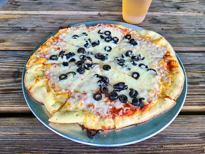 This black olive and cheese pizza might seem like an odd choice at a seafood joint, but one bite of that perfect crust will silence any doubts.