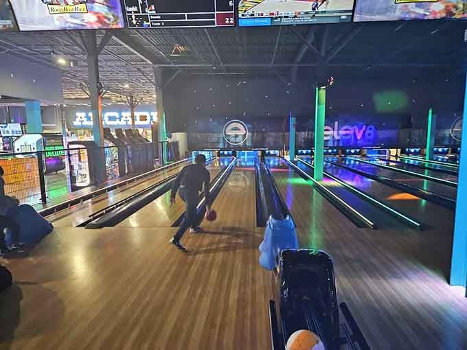 Modern bowling lanes glow with possibility, where strikes feel like victories and even gutter balls can't dampen the festive atmosphere completely.
