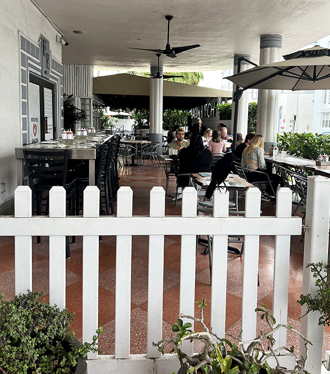 The outdoor patio offers prime people-watching along with your breakfast, protected by a charming white picket fence.