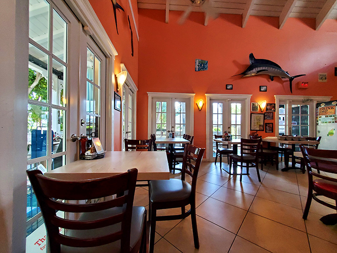 The dining room balances nautical charm with airy elegance &ndash; where mounted fish tell tales of the deep and windows frame views of paradise.