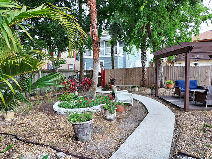 Garden Walkway Patio: Follow this winding path through lush greenery, where rustling leaves might be the breeze or perhaps something more mysterious.