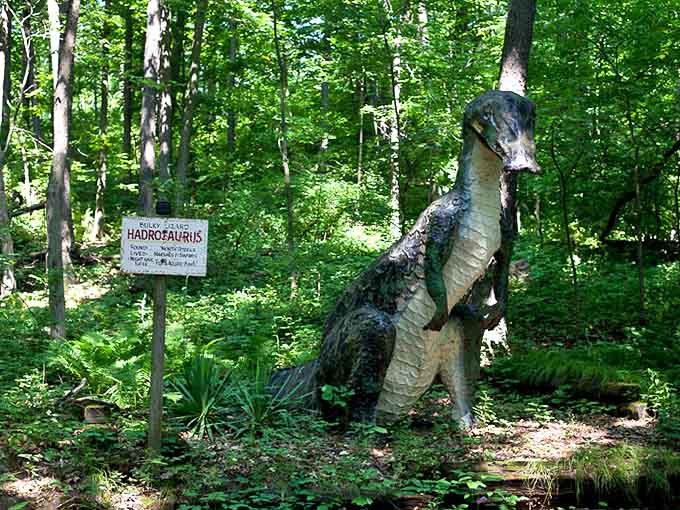 The Hadrosaurus stands proudly with its informational sign, still educating visitors after all these years.