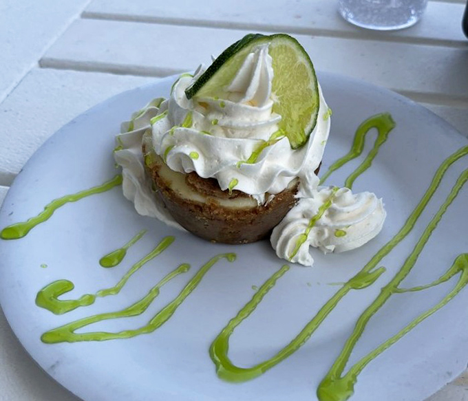 Key lime pie gets the checkered flag with its perfect balance of sweet and tart, topped with whipped cream and lime zest for a photo-finish dessert.