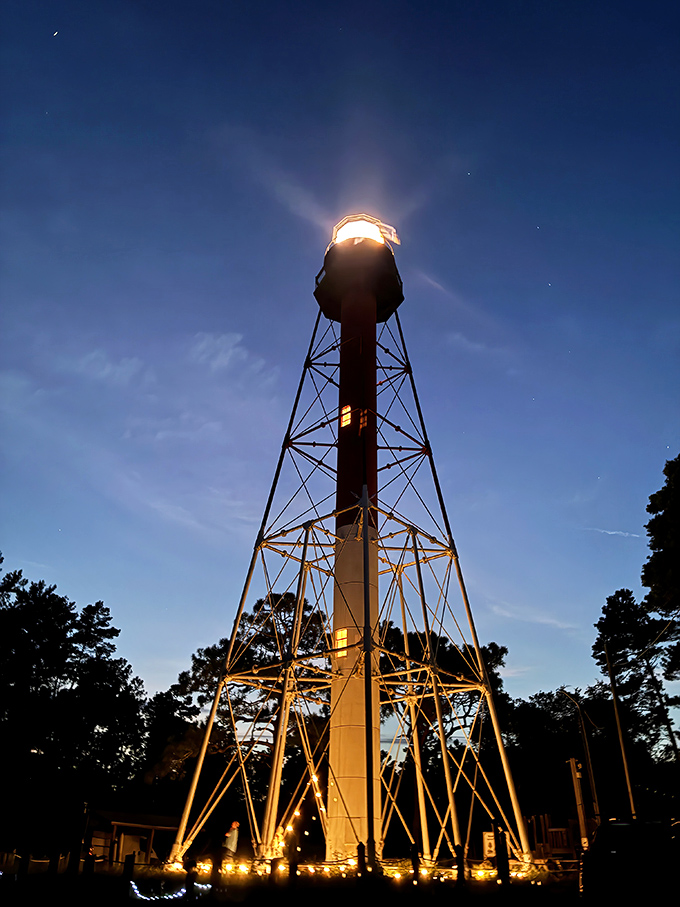 When darkness falls, the lighthouse awakens, sending beams across the water like nature's own disco ball.