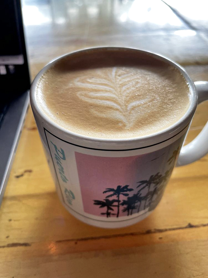 Latte art so pretty you almost feel bad disturbing it. Almost. The palm tree mug adds a perfect touch of Florida charm.