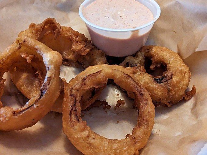 Onion Rings: These golden halos of happiness aren't just side dishes&mdash;they're crispy, hand-battered masterpieces that have probably prevented family feuds over who gets the last one.