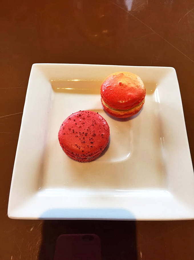 These macarons don't just pop with color&mdash;they're like edible jewelry boxes hiding fruity treasures between their delicate shells.