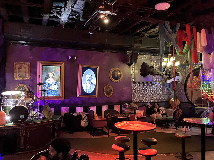 The bar's interior features Victorian-inspired furniture, vintage portraits, and musical instruments that create a hauntingly elegant atmosphere.