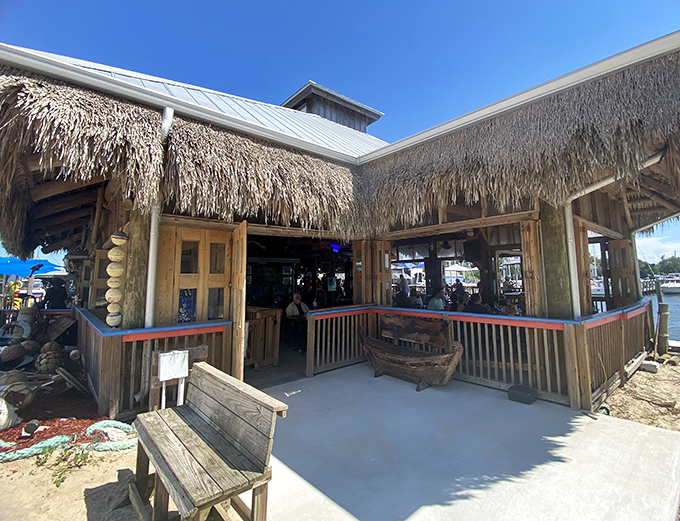 The thatched entrance to paradise &ndash; where stress checks out and appetites check in for the duration.