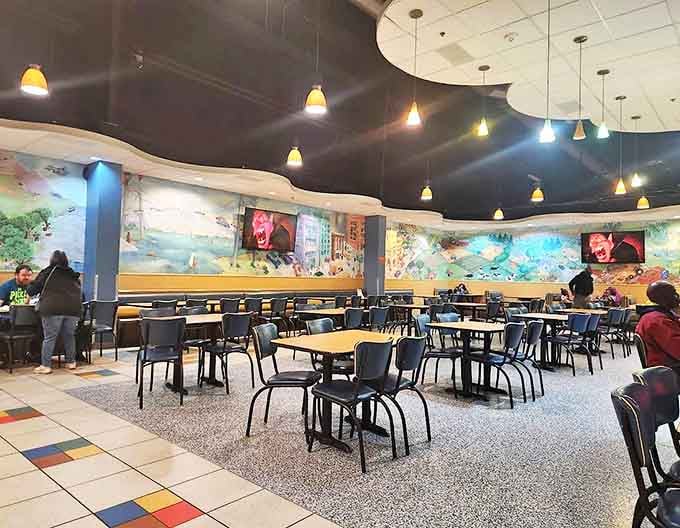 Dining area: Refueling station decorated with vibrant murals where hungry adventurers replenish their energy reserves between attractions.