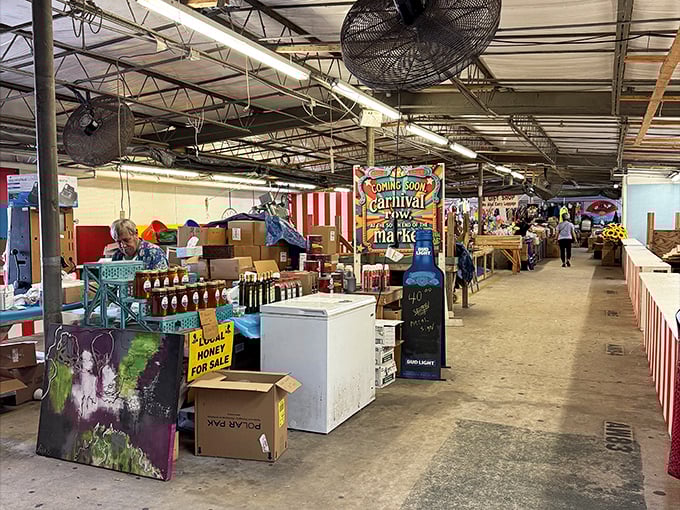The interior of Renninger's Market reveals rows of vendor stalls where treasure hunters can spend hours browsing unique finds and fresh goods.