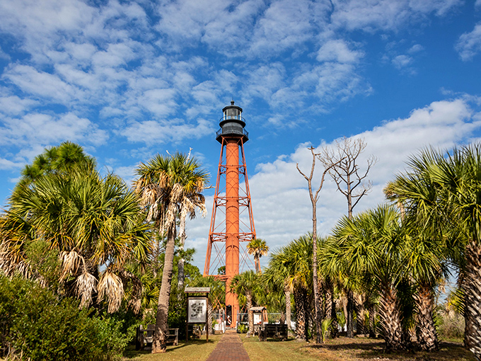 Anclote Key Lighthouse: Standing tall since 1887, this crimson sentinel rises from a sea of palms like Florida's own tropical Eiffel Tower.