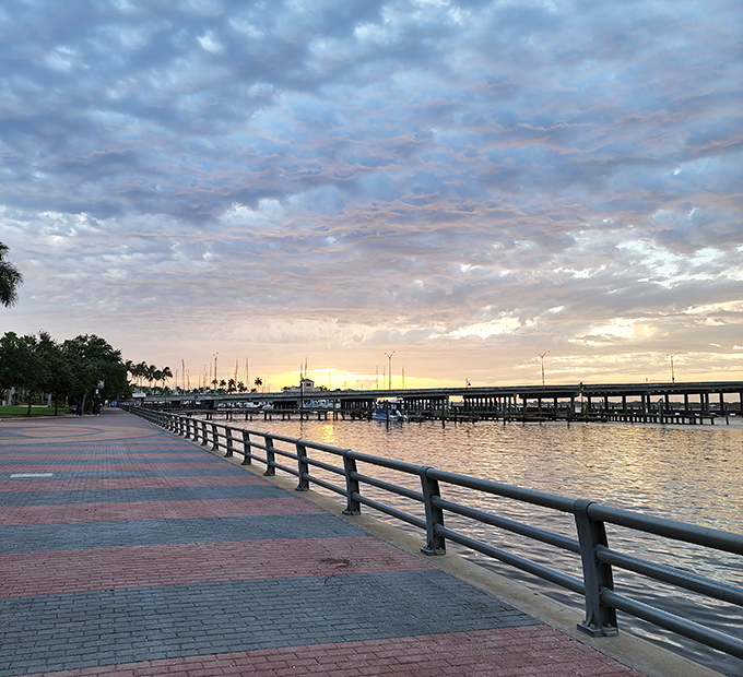 Sunset transforms the Bradenton Riverwalk into a painter's dream, where water and sky compete for who can look more spectacular.