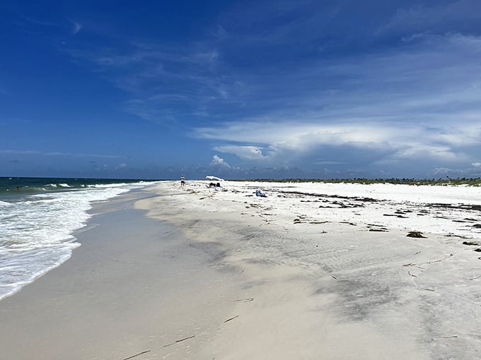Pristine white sands stretch for miles at Crooked Island Beach, where the crowds are noticeably absent and the Gulf waters shimmer in fifty shades of blue.