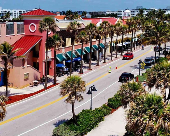 Downtown Lake Worth: Coral-hued buildings and swaying palms create a tropical main street vibe that screams "Florida" without a single Mickey Mouse in sight.
