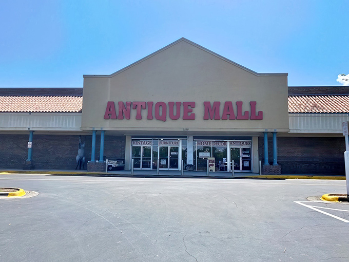 The unassuming facade of Lakeland Antique Mall belies the wonderland of vintage treasures waiting inside, like a time portal disguised as a strip mall storefront.